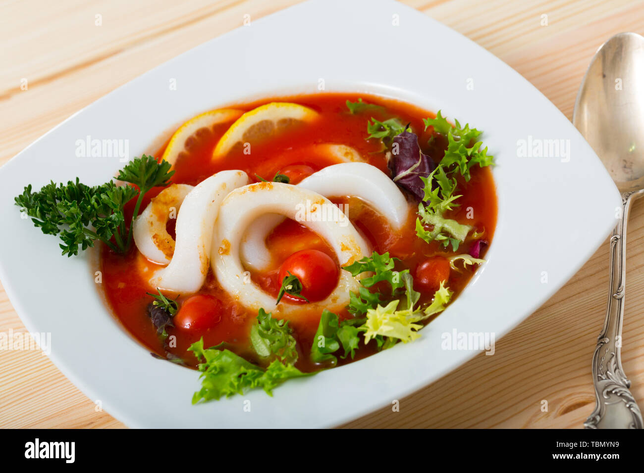 Photography of plate with tomato soup with squid in restaurante Stock ...