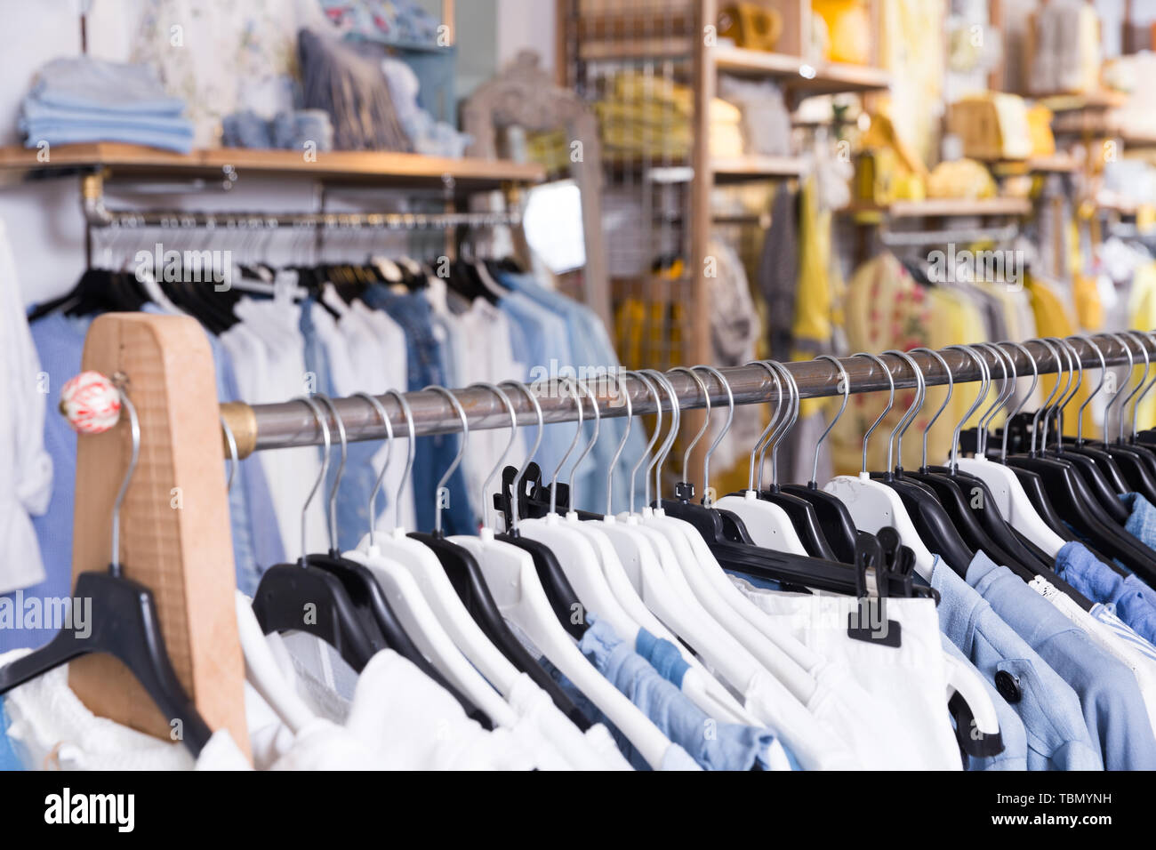 Image of different colored clothes in the modern shopping centre Stock ...