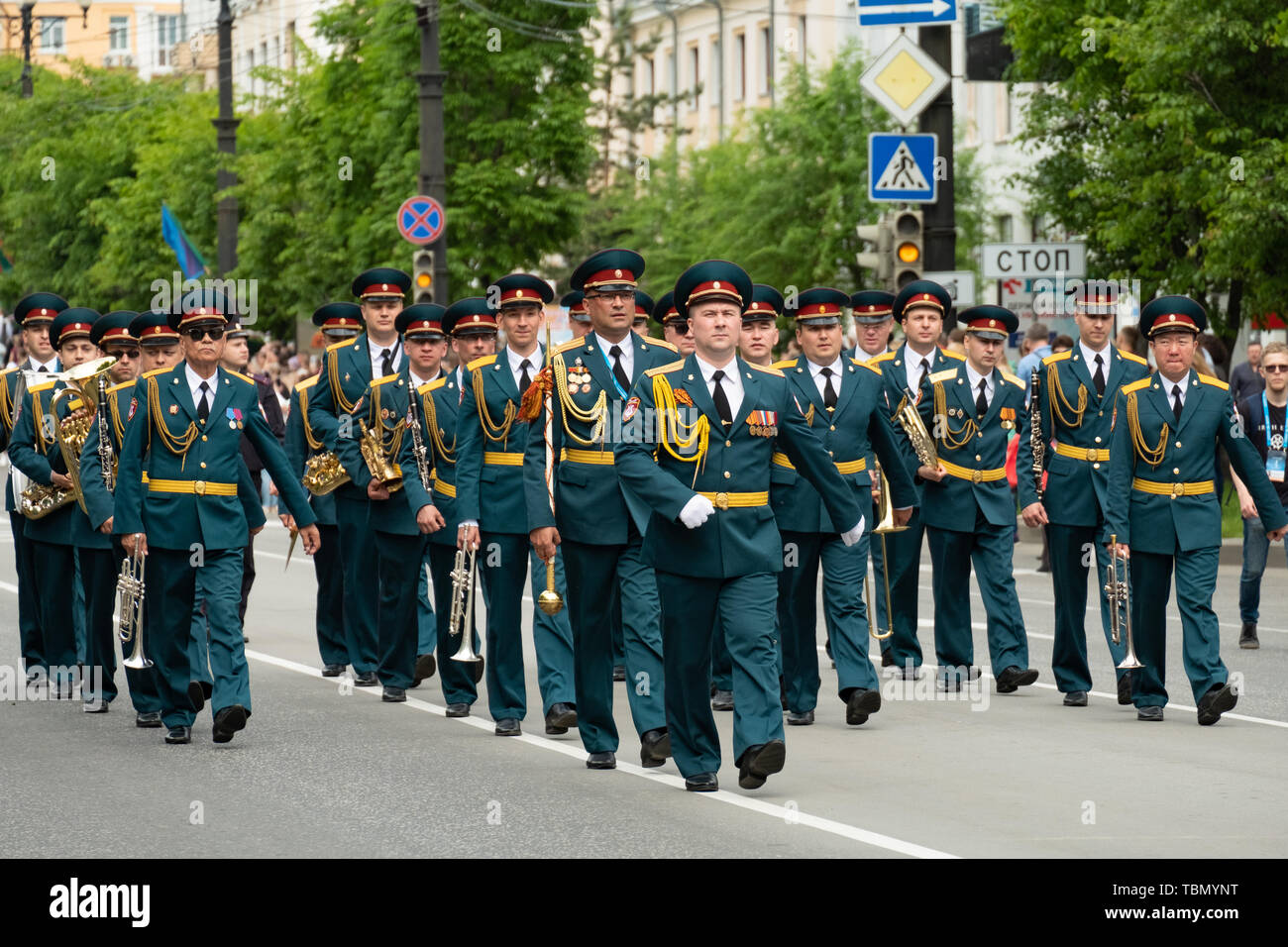 Military music bands marching through the empty streets of the city of ...