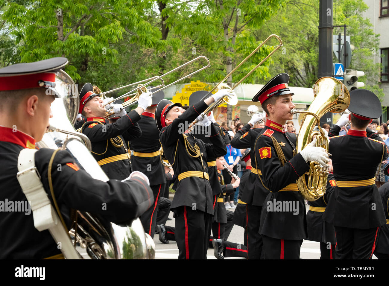 Military music bands marching through the empty streets of the city of ...