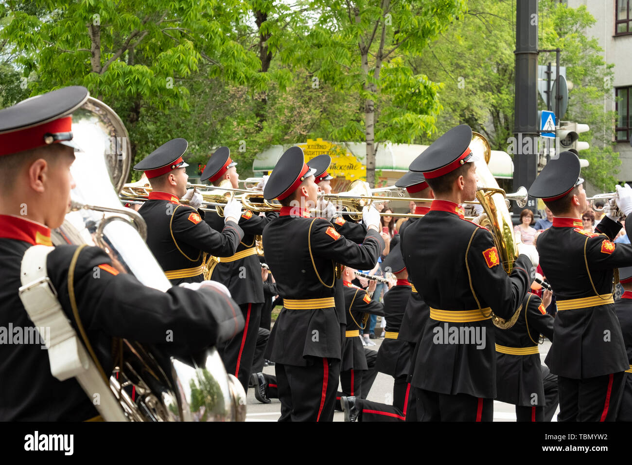 Military music bands marching through the empty streets of the city of ...