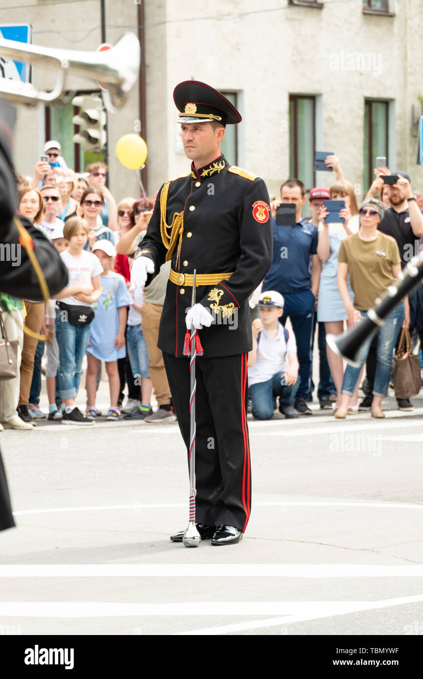 Military music bands marching through the empty streets of the city of ...
