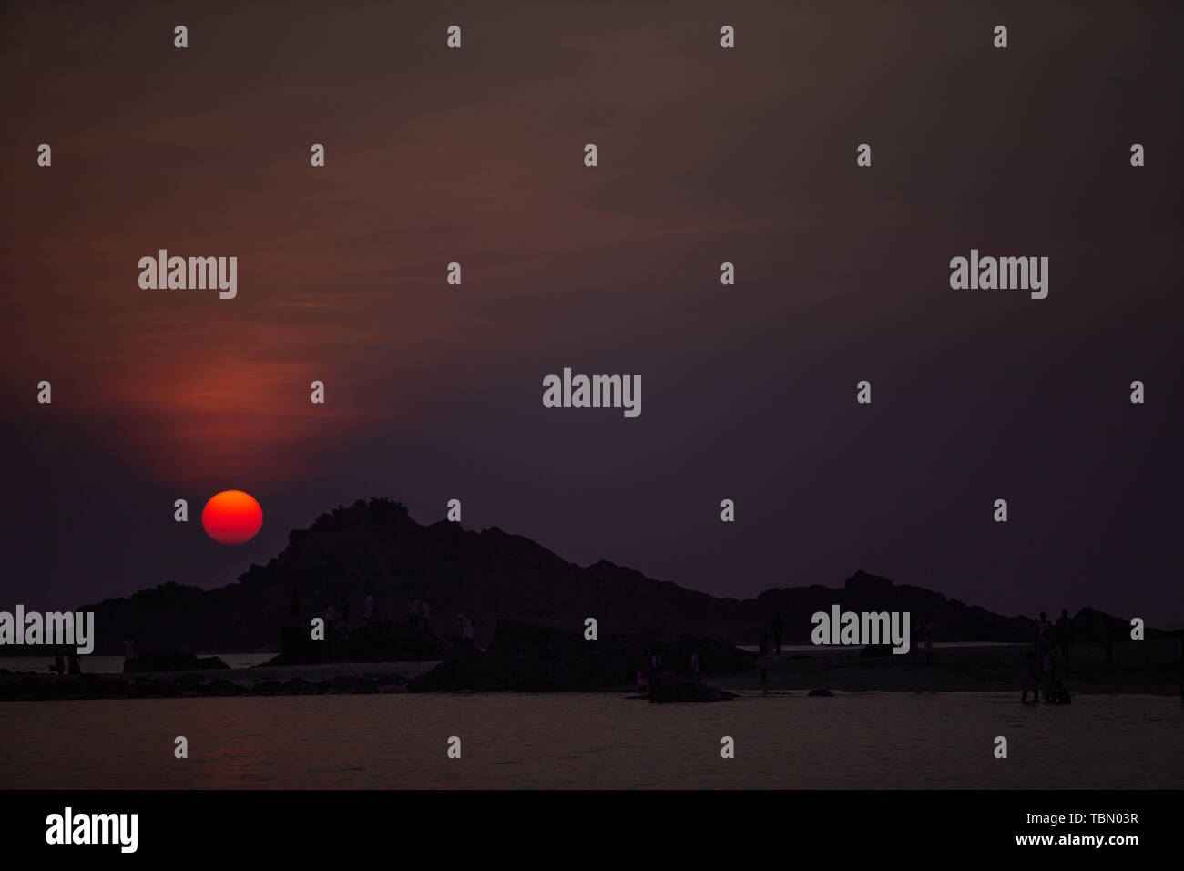 Sunset on the beach in Goa, India Stock Photo - Alamy