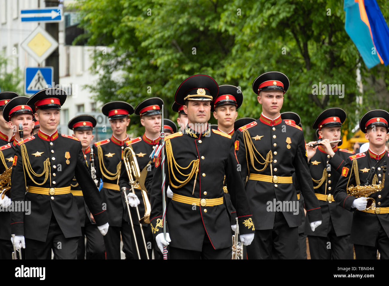 Military music bands marching through the empty streets of the city of ...