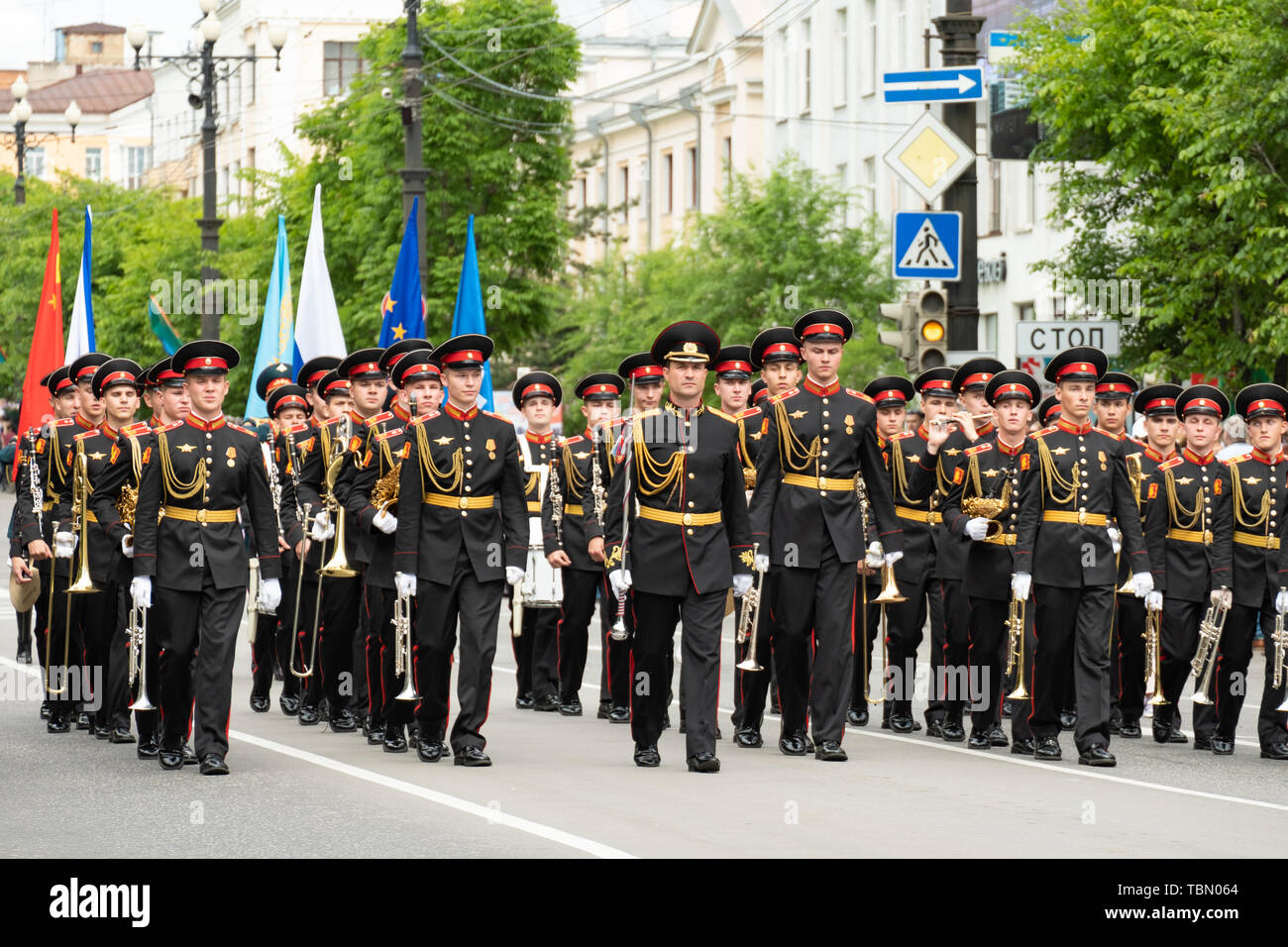 Military music bands marching through the empty streets of the city of ...