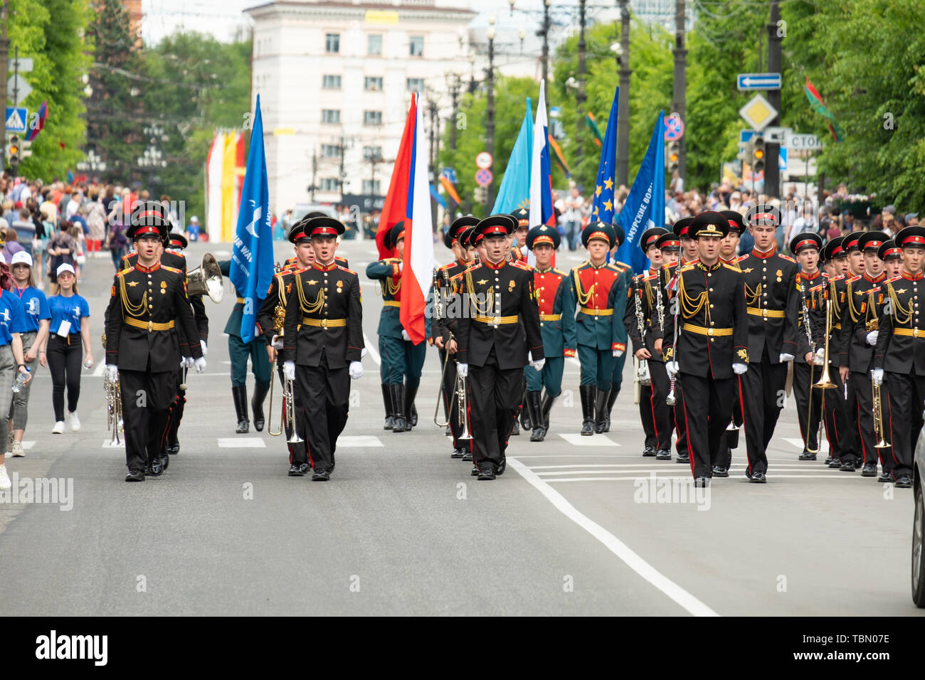 Military music bands marching through the empty streets of the city of ...