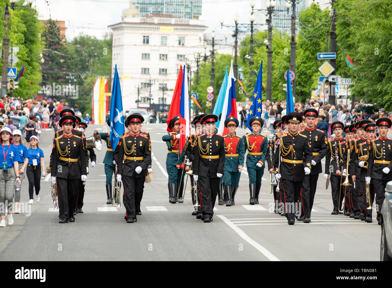 Military music bands marching through the empty streets of the city of ...