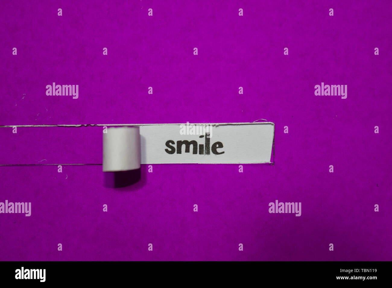 Smile, Inspiration, Motivation and business concept on purple torn ...