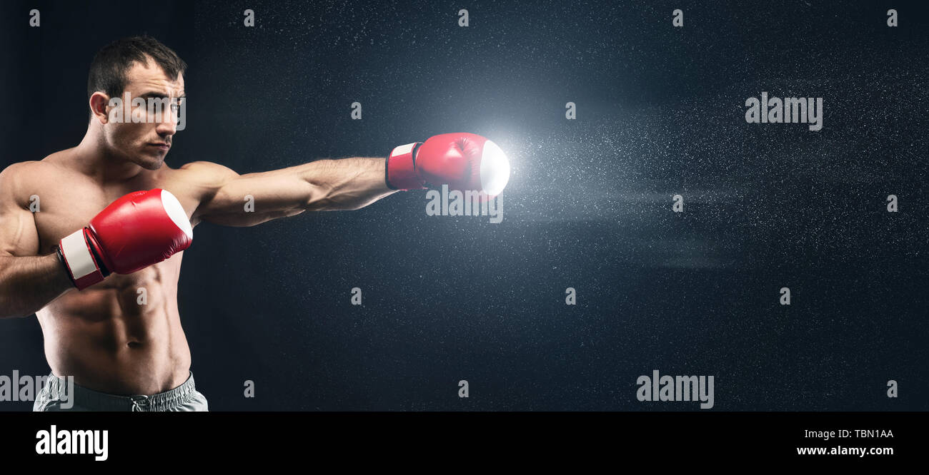 Attractive man boxer showing the power of his punch Stock Photo - Alamy