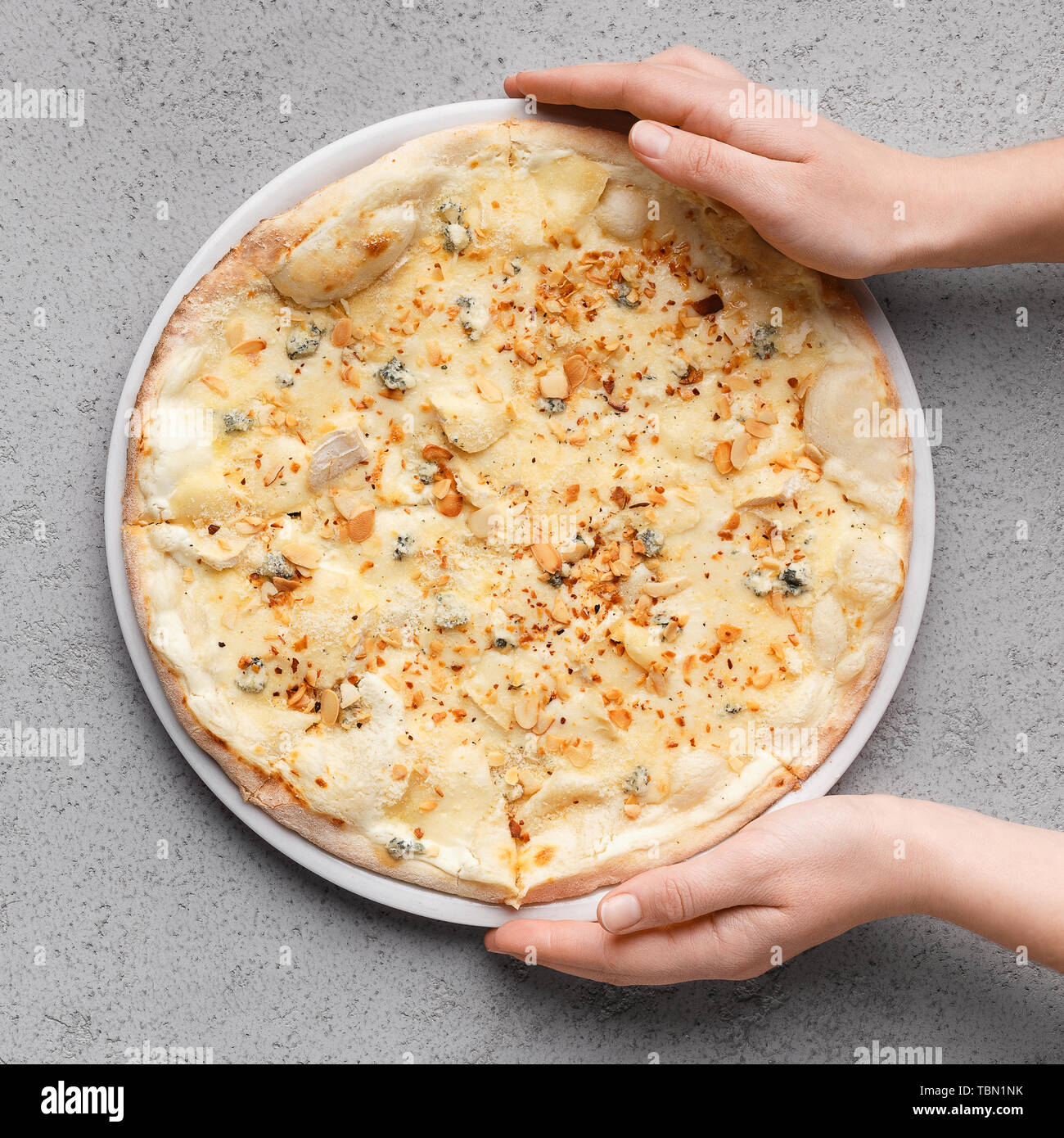 Woman hands put pizza on hi-res stock photography and images - Alamy