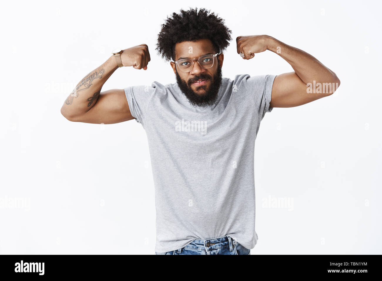 Portrait of good-looking self-satisfied african american guy working ...