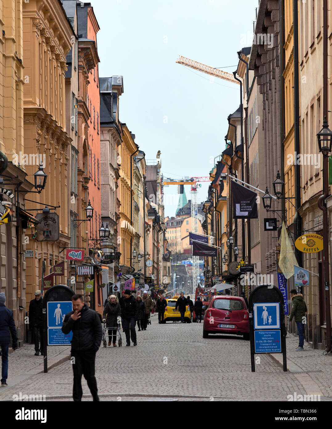 Pedestrian in stora nygatan street in gamla stan hi-res stock ...