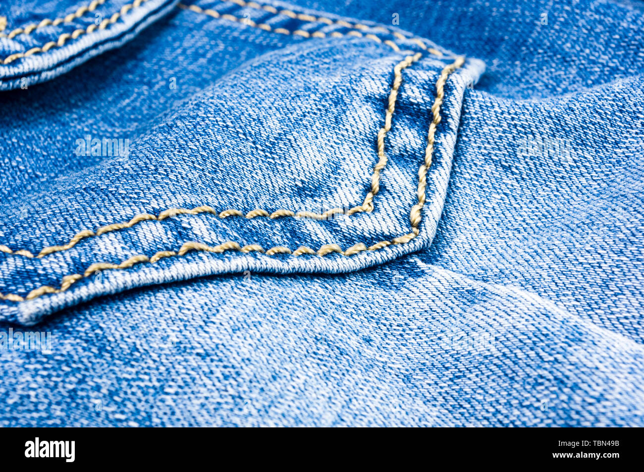 clothing items blue washed faded jeans cotton fabric texture with seams ...