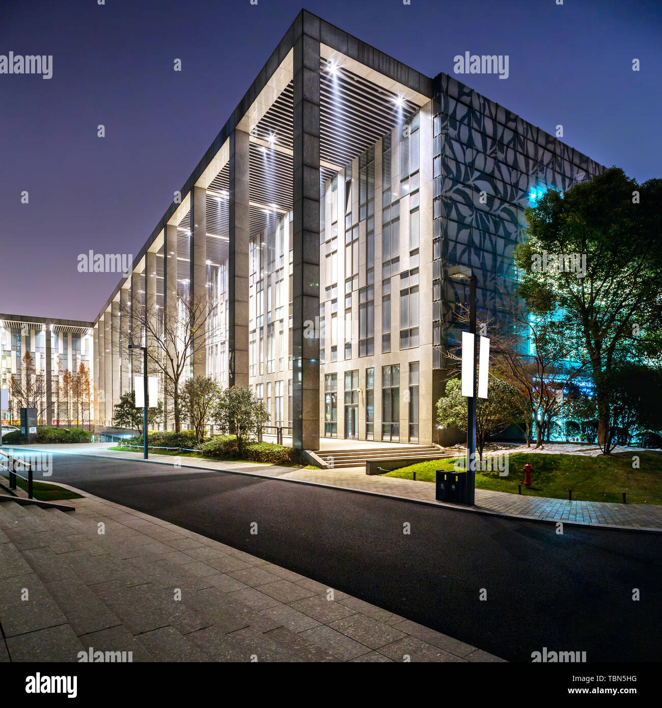 Exterior of modern building at night Stock Photo - Alamy