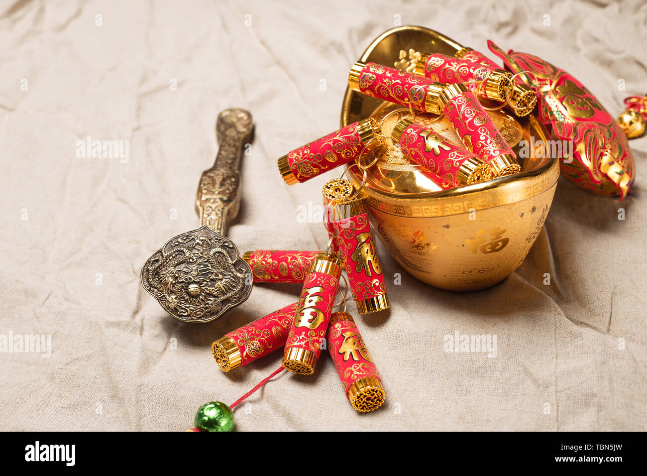 Traditional chinese firecrackers ,ruyi and gold ingots Stock Photo - Alamy