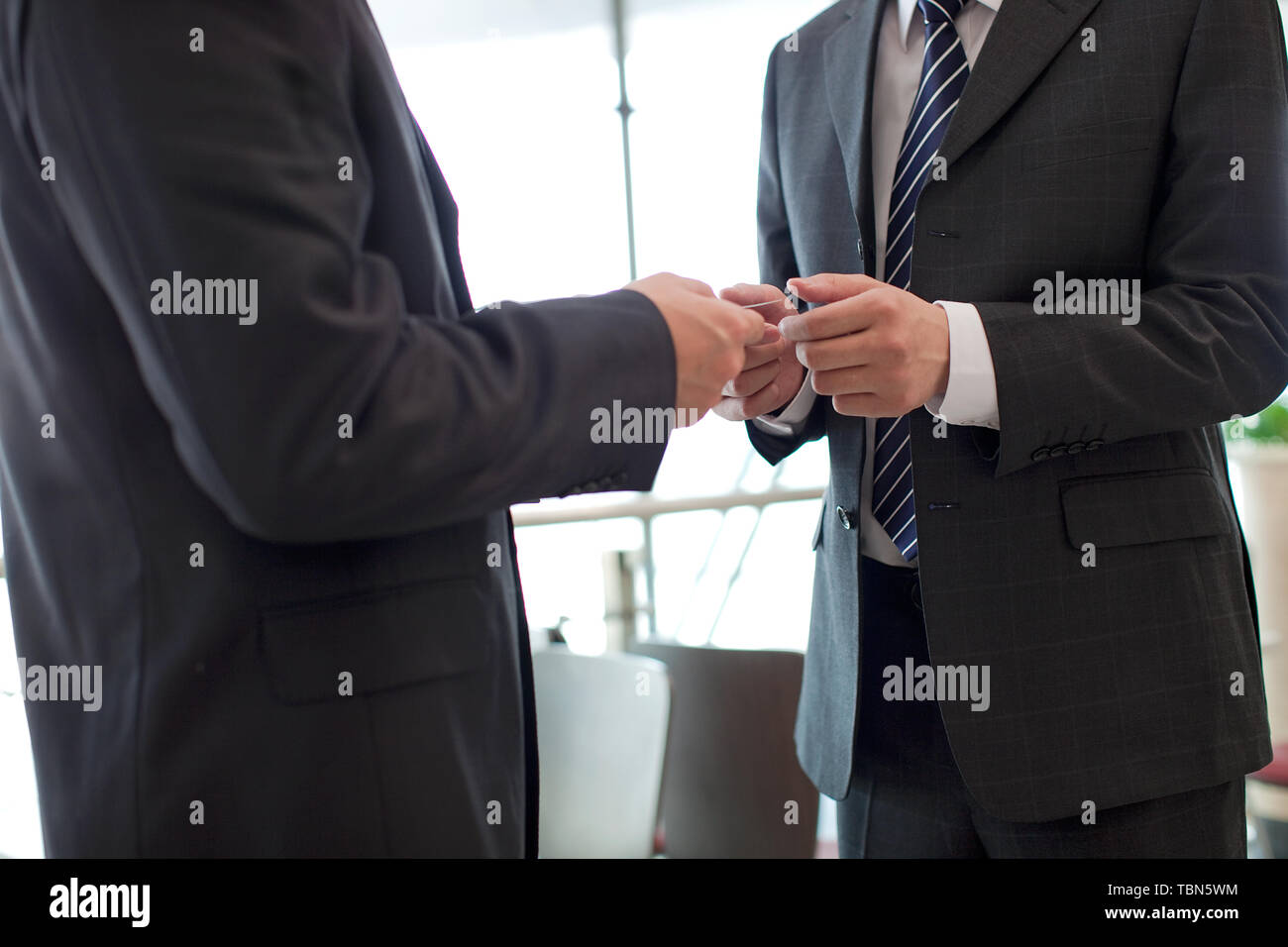 handing business cards Stock Photo - Alamy