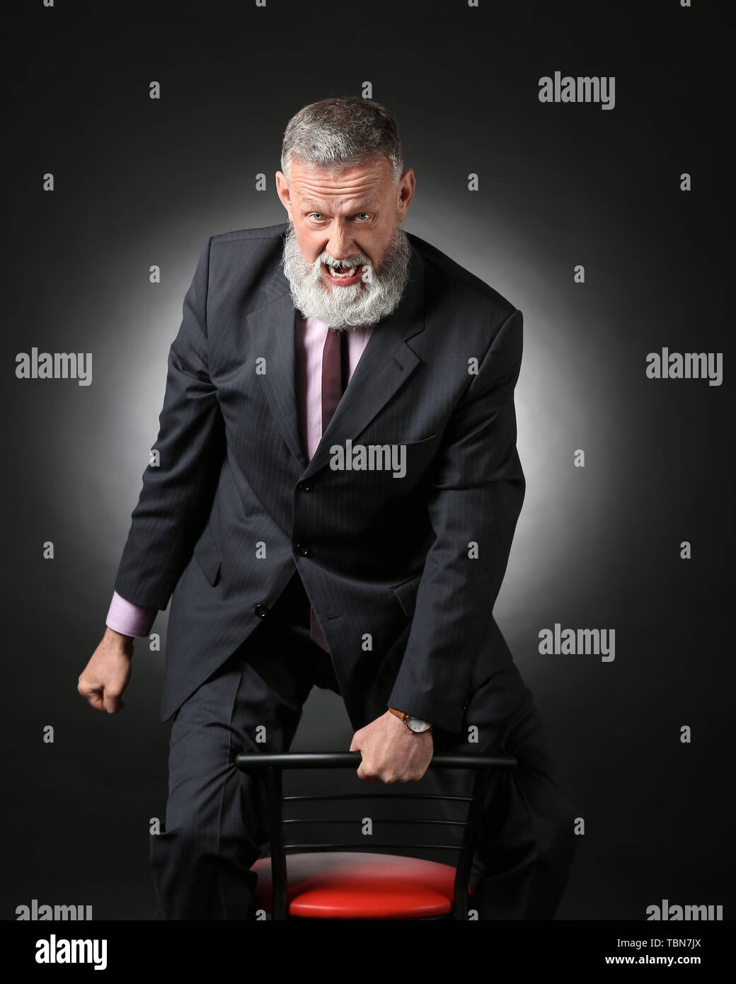 Angry middle aged businessman sitting hi-res stock photography and ...