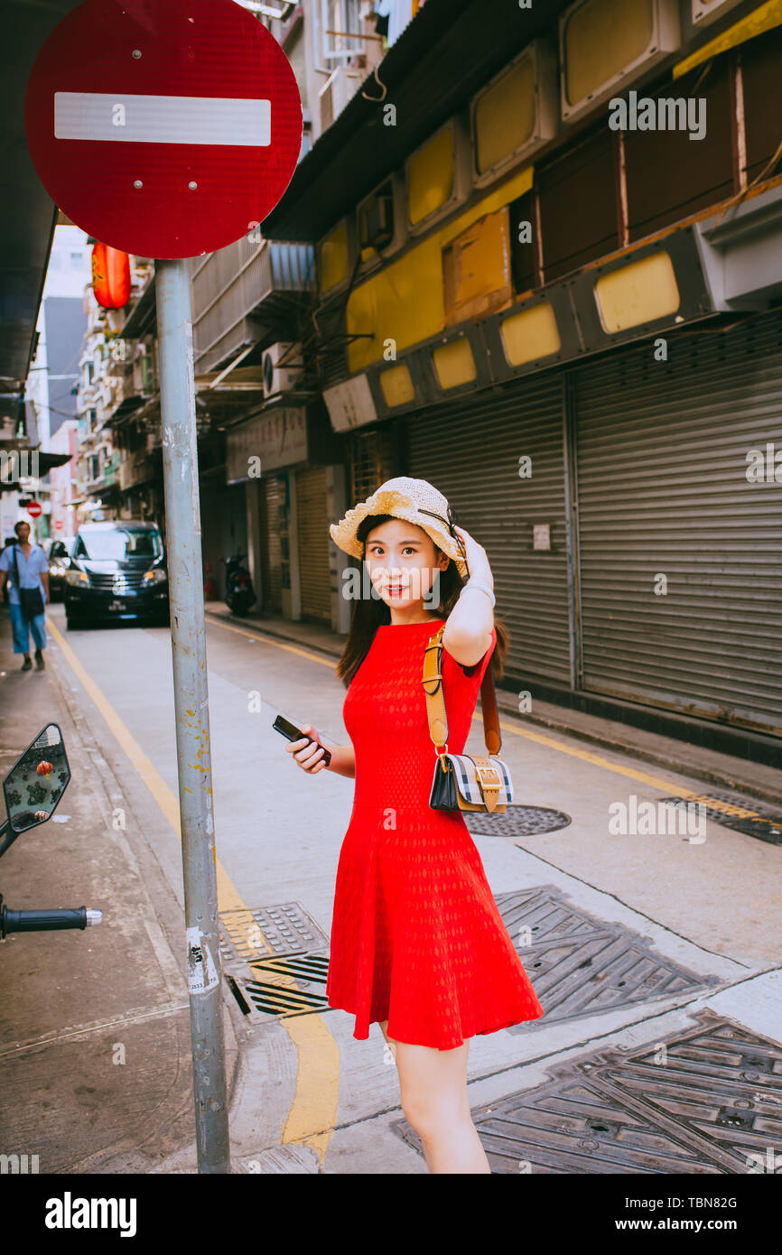 Red dress tour the big three buses Stock Photo - Alamy