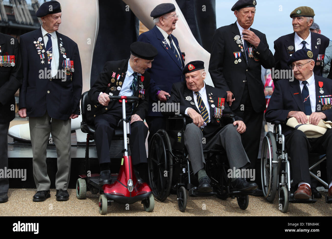 D-Day veterans gather under the 'Embracing Peace' statue, during a D ...