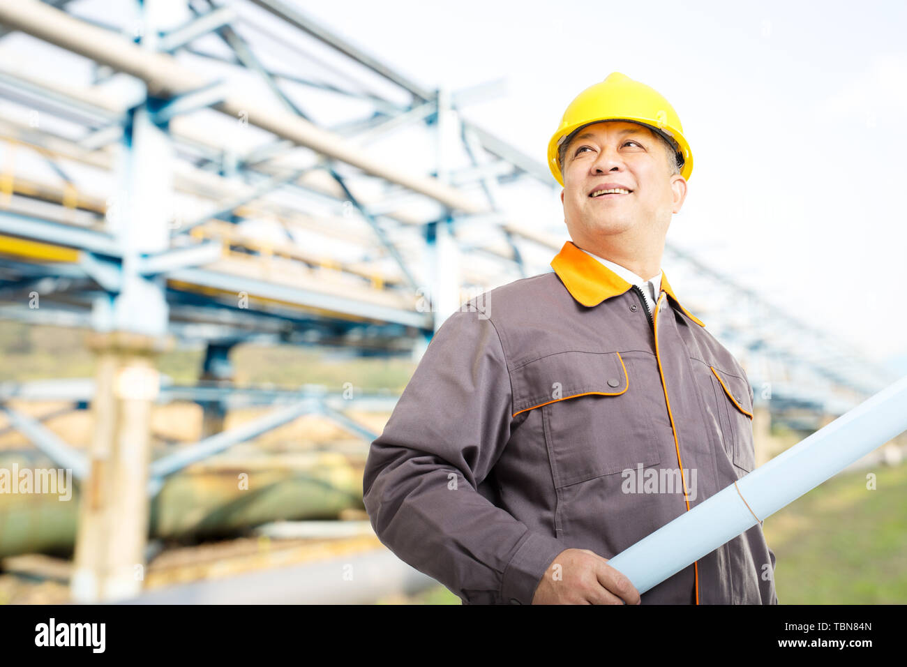 old chinese man engineer in oil refinery plant Stock Photo - Alamy