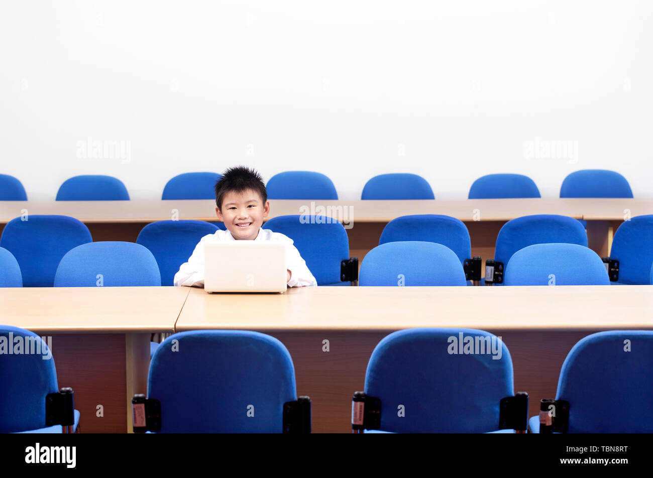 Three primary school students are in class in the classroom Stock Photo ...