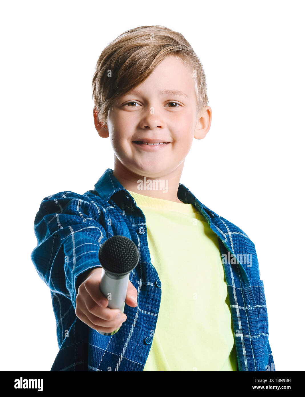 Cute little boy with microphone against white background Stock Photo ...