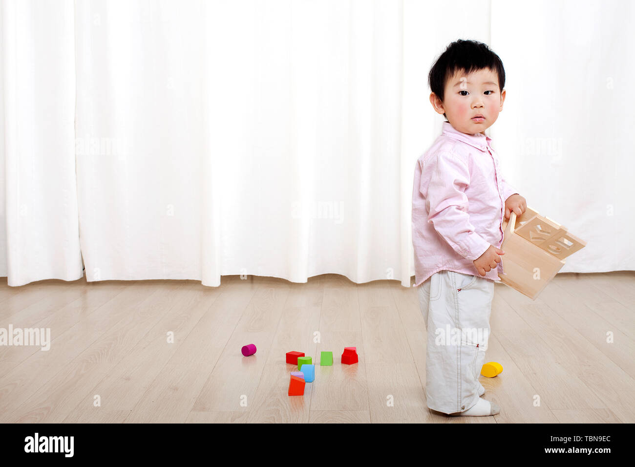 A child acquires knowledge in a game Stock Photo - Alamy