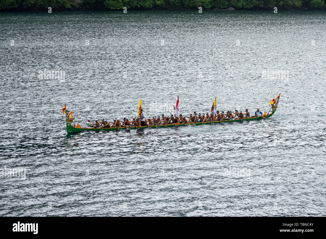 Villagers in traditional long boat greeting the arrival of L'Austral as ...
