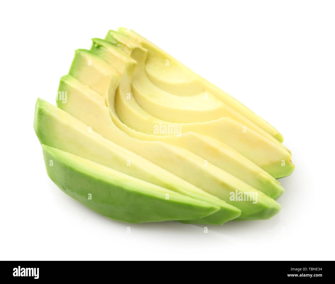 Fresh cut avocado on white background Stock Photo - Alamy