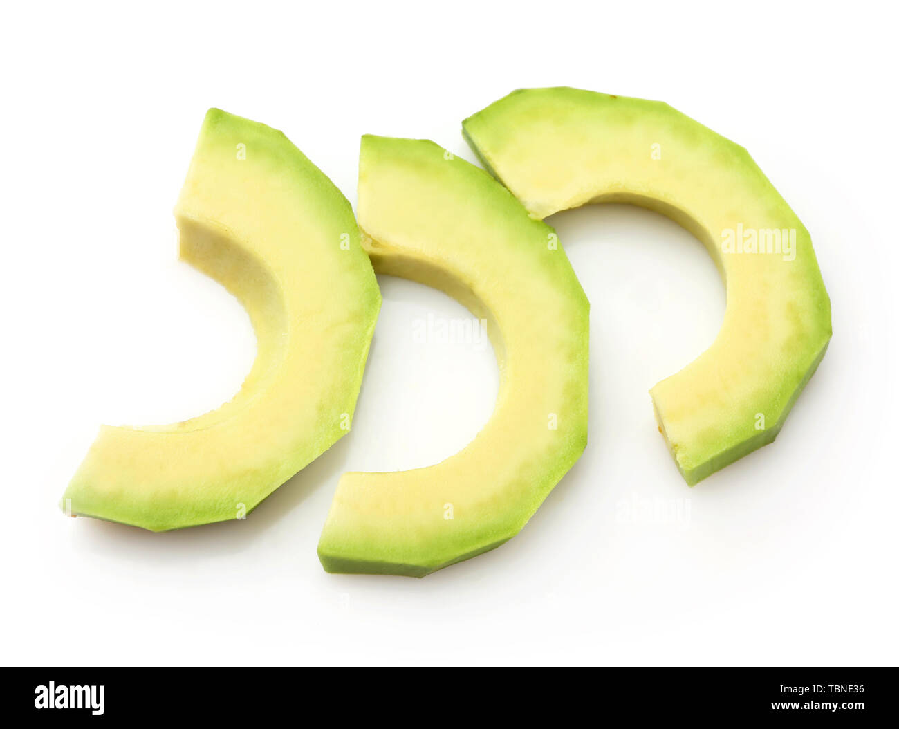 Fresh cut avocado on white background Stock Photo - Alamy
