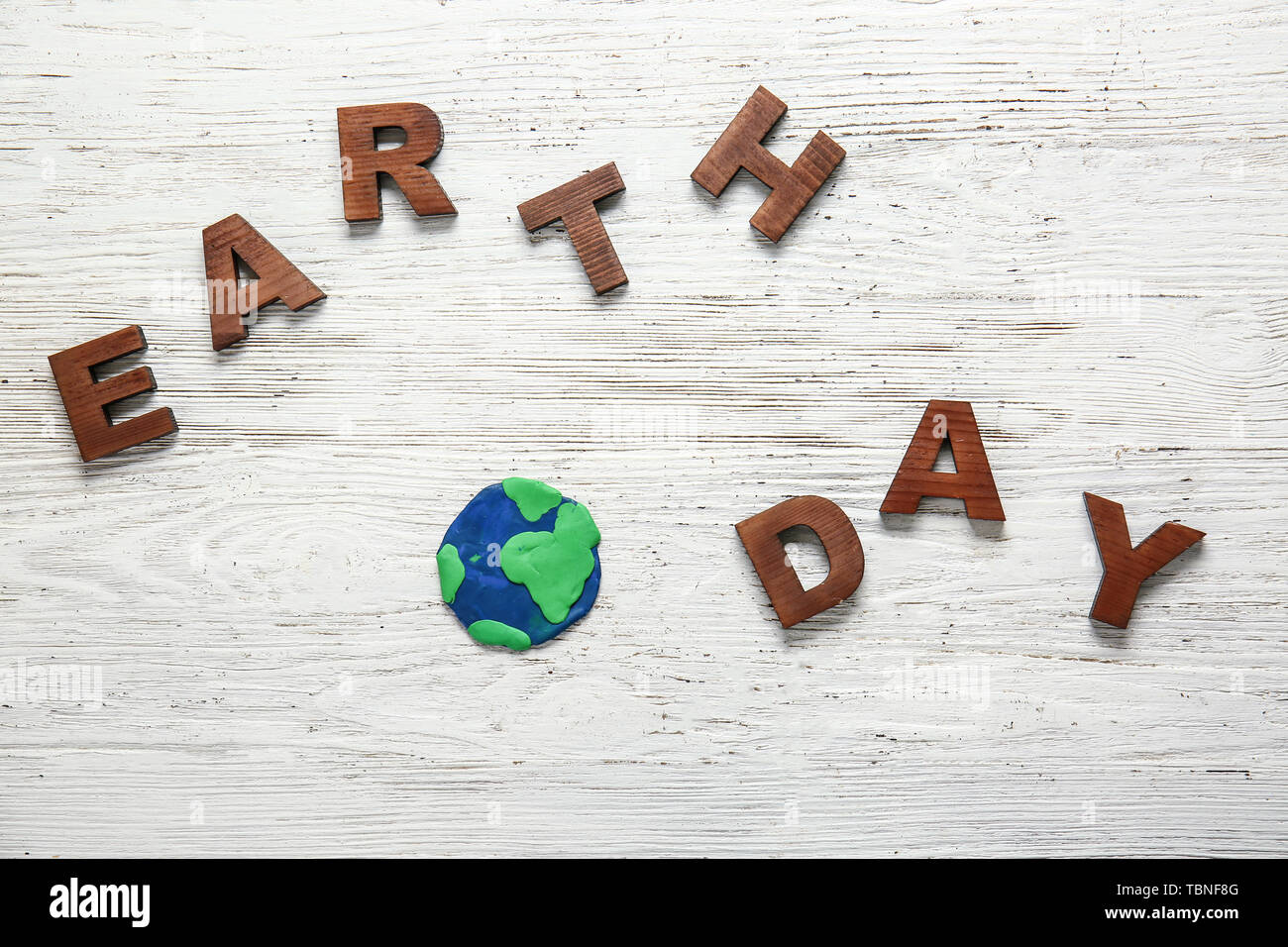 Text EARTH DAY composed from letters and shape of planet on white ...