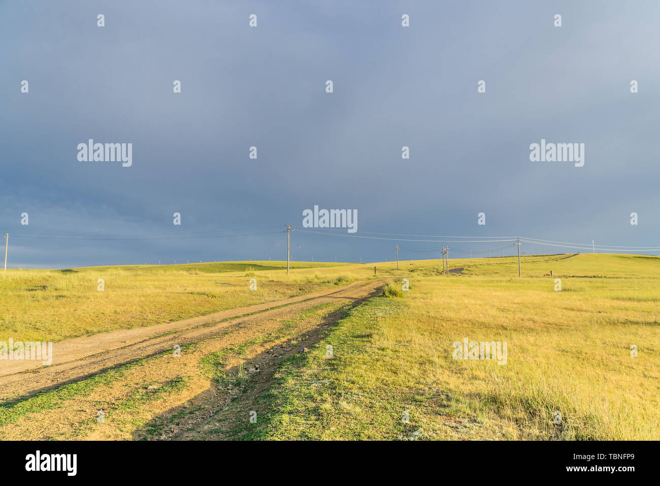 Hillside prairie villages under cloudy clouds Stock Photo - Alamy