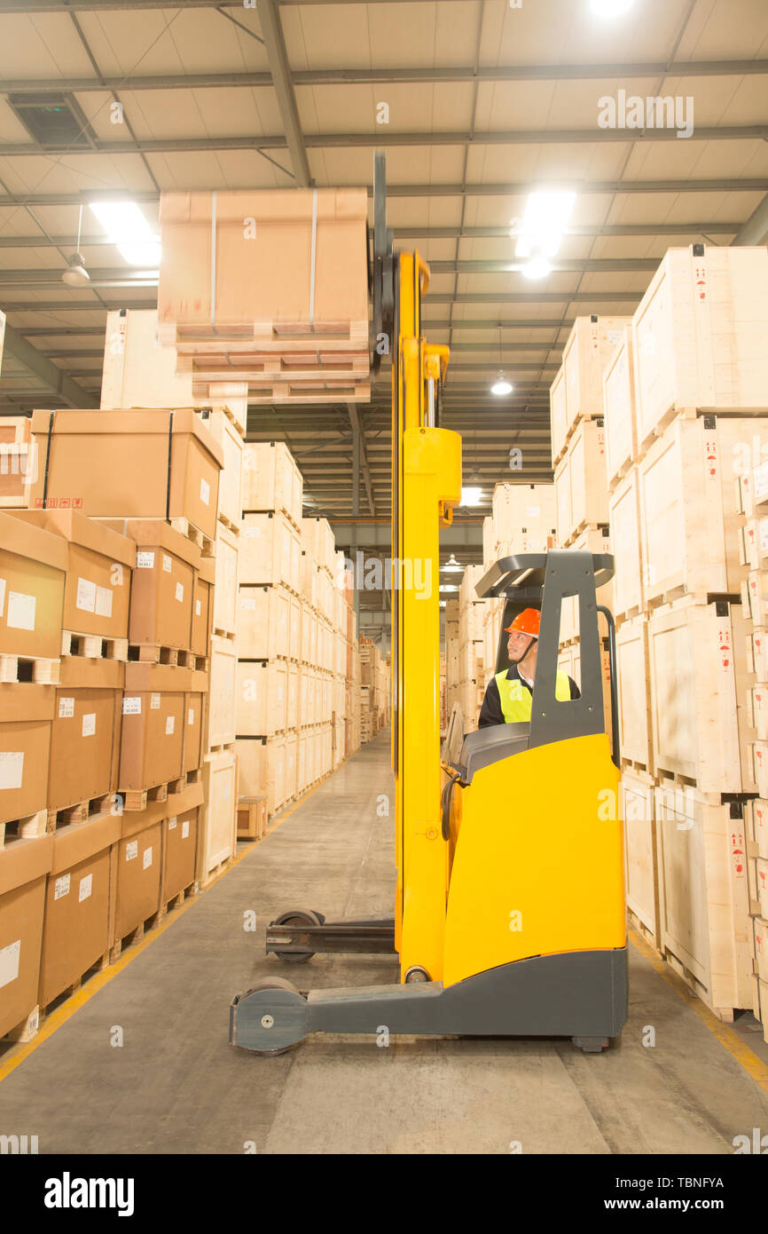 Logistics personnel load and unload cargo at the warehouse Stock Photo ...