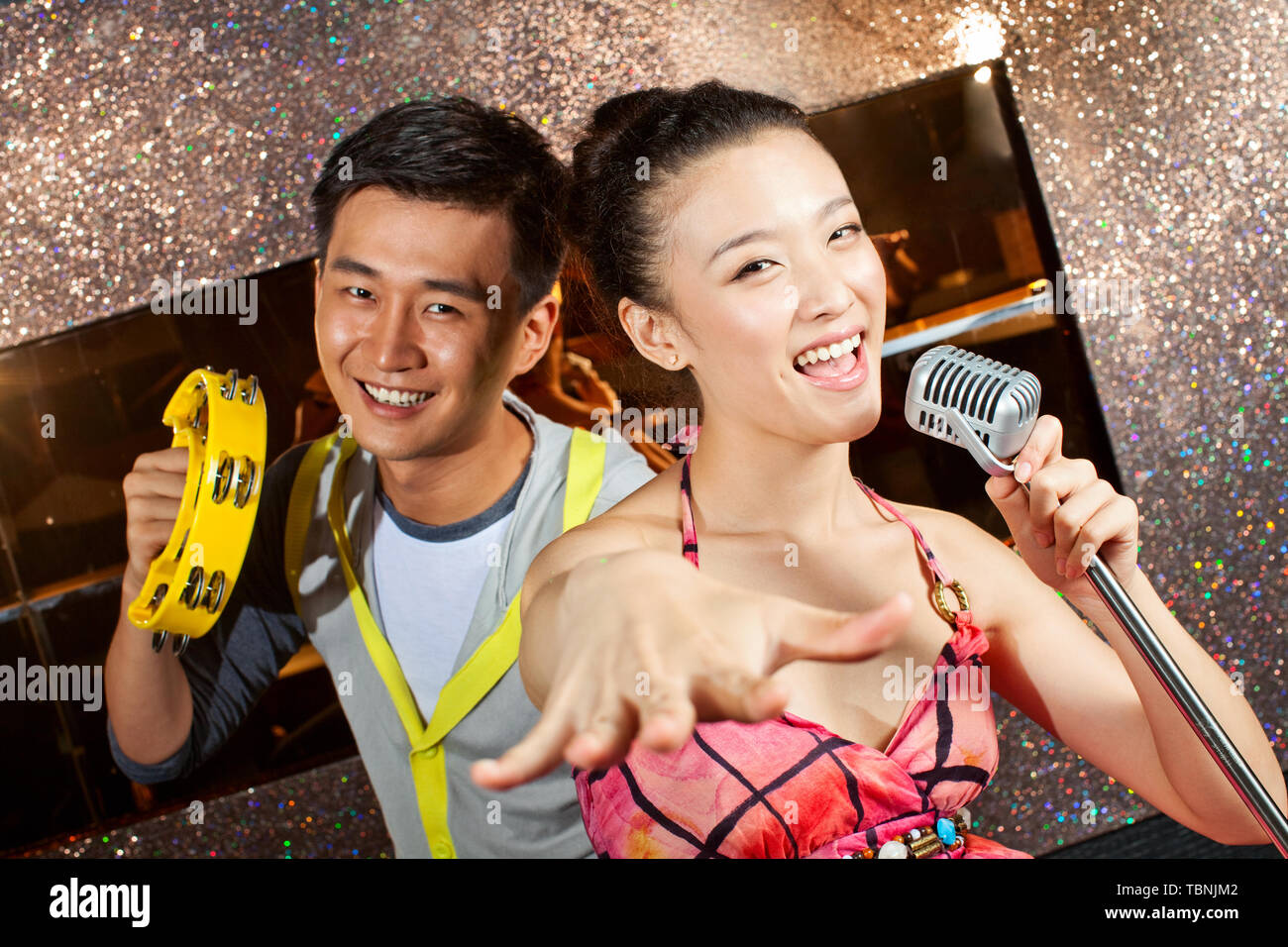 Singing microphone tambourine hi-res stock photography and images - Alamy