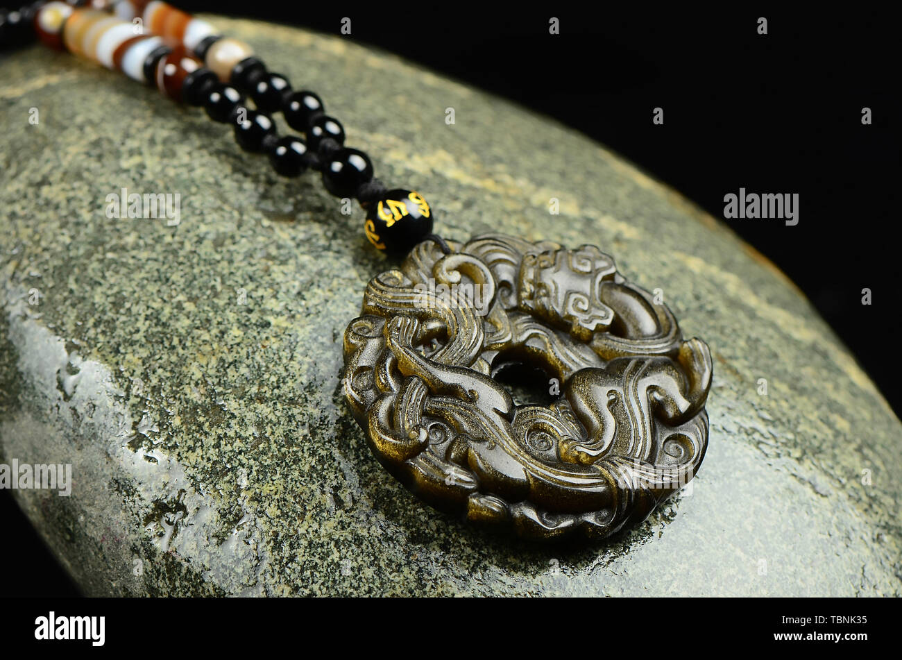 Obsidian Obsidian Pixiu pendant Stock Photo - Alamy