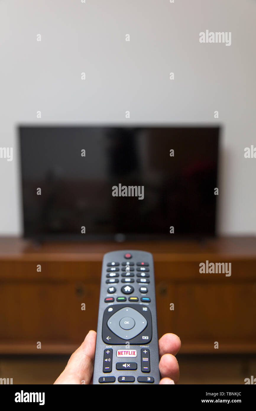 BELGRADE, SERBIA - MAY 9, 2019: Hand holding an Netflix remote control ...