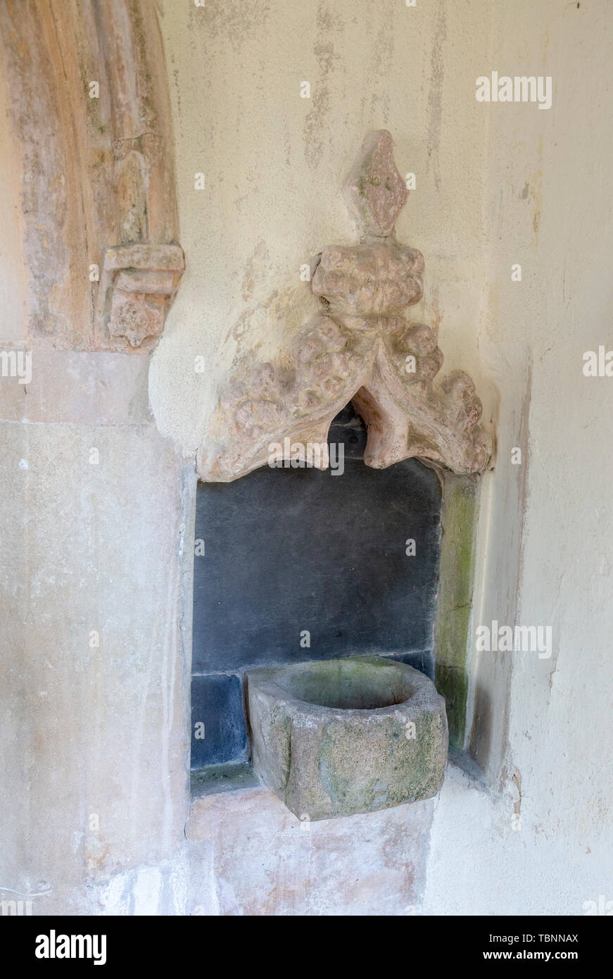 Holy water stoup bowl in porch entrance, village parish church of St ...