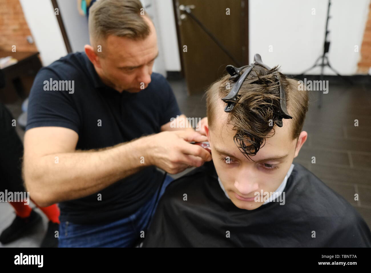 Happy guy getting haircut hi-res stock photography and images - Alamy