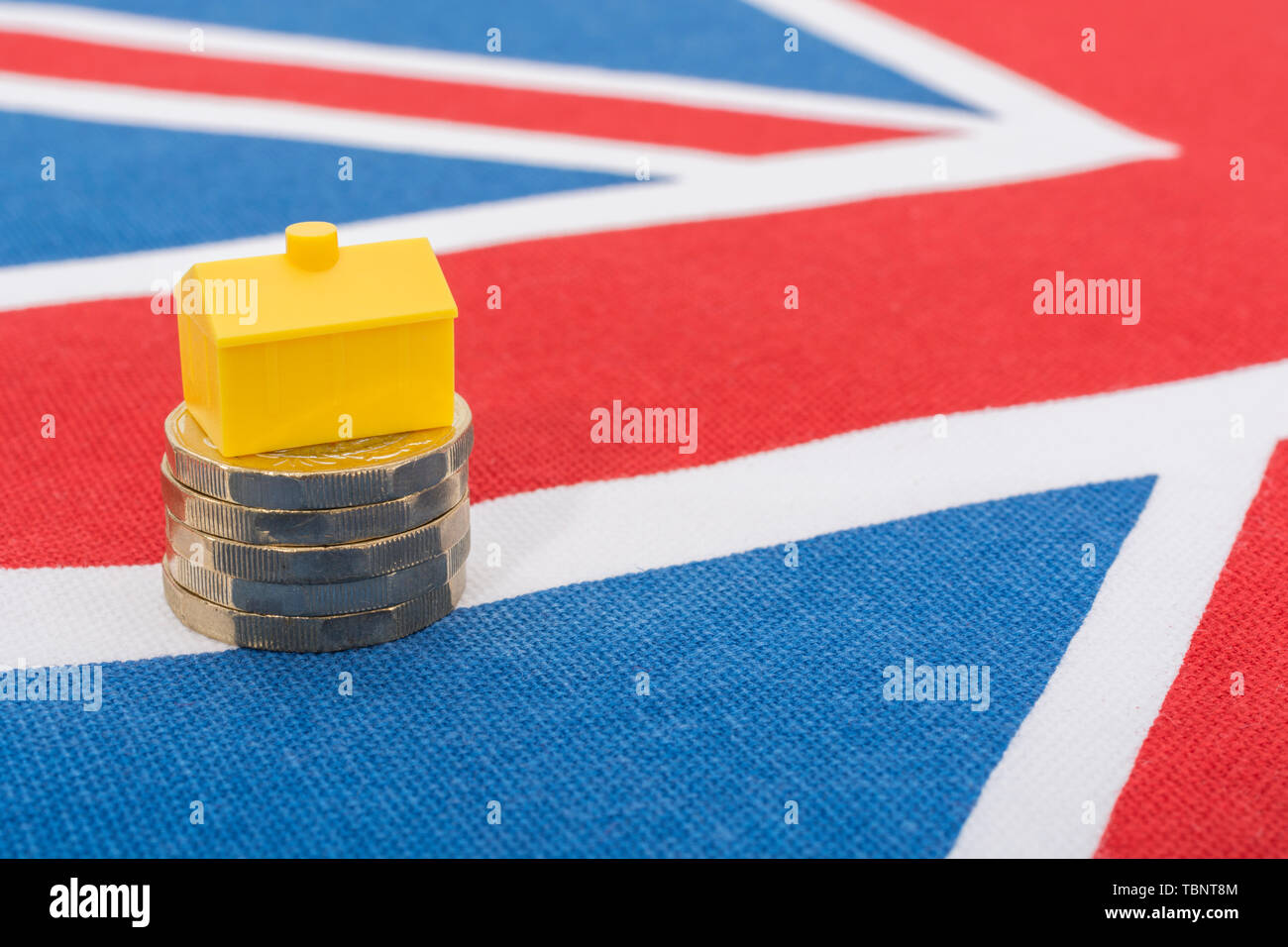 Union Jack & small toy counter. For UK housing crisis, getting on the ...
