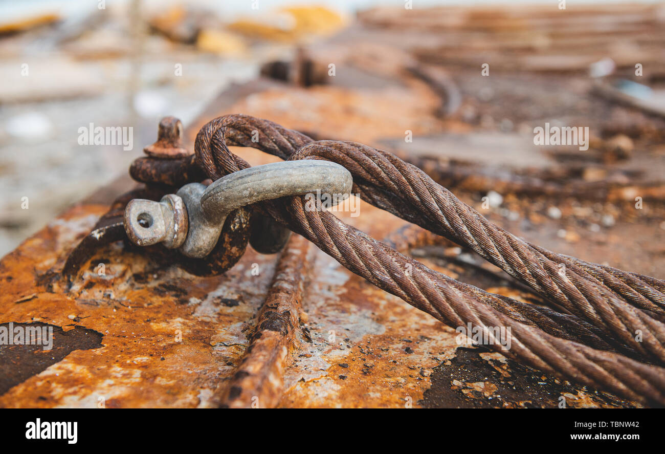 Old metal rusty sling cable and grunge iron texture background with ...