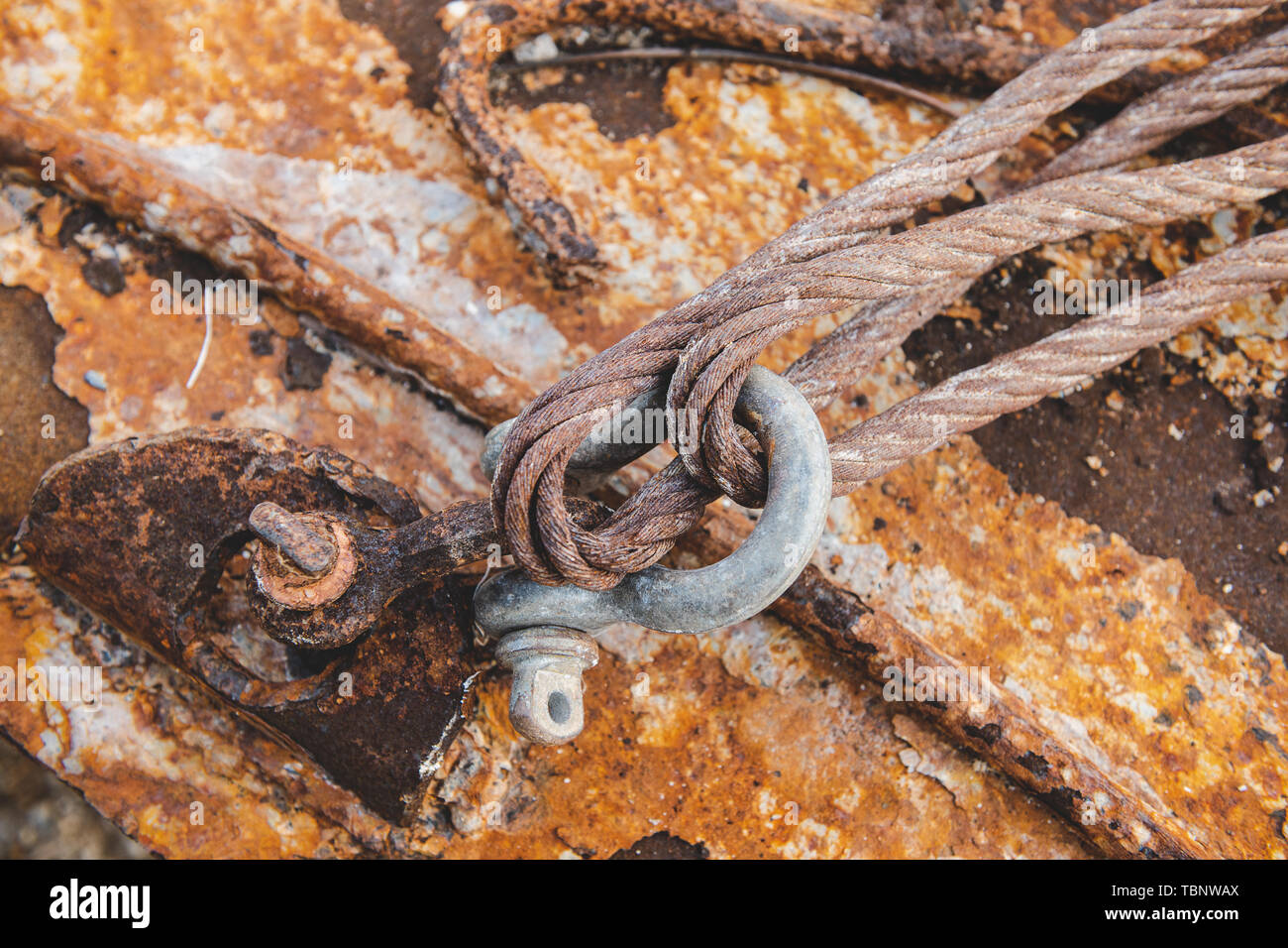 Old metal rusty sling cable and grunge iron texture background with ...