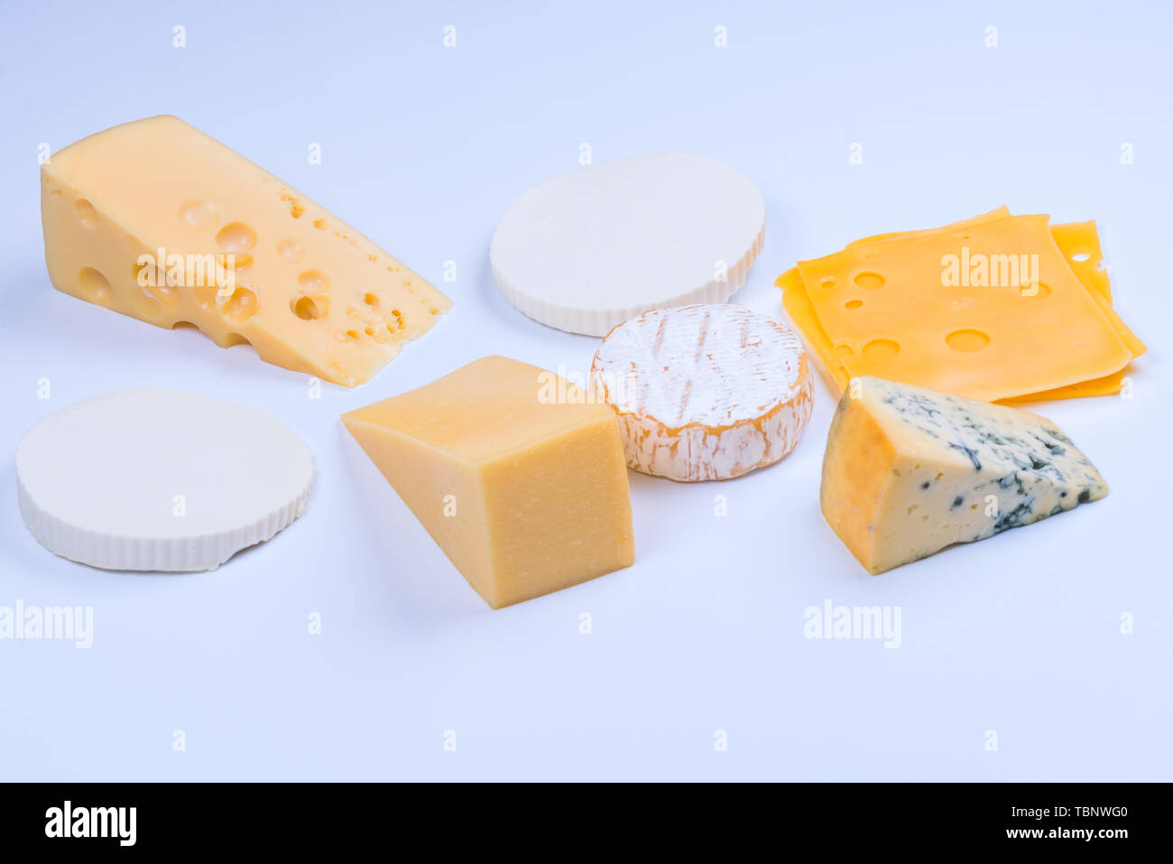 Different types of cheese on white background Stock Photo - Alamy