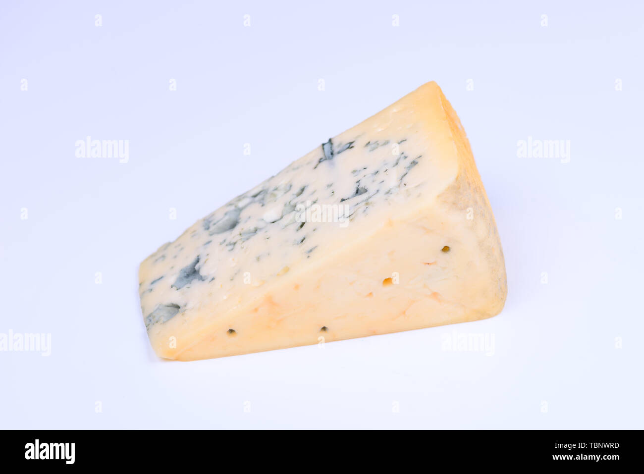 big piece of cheese with mold close up on white background Stock Photo ...