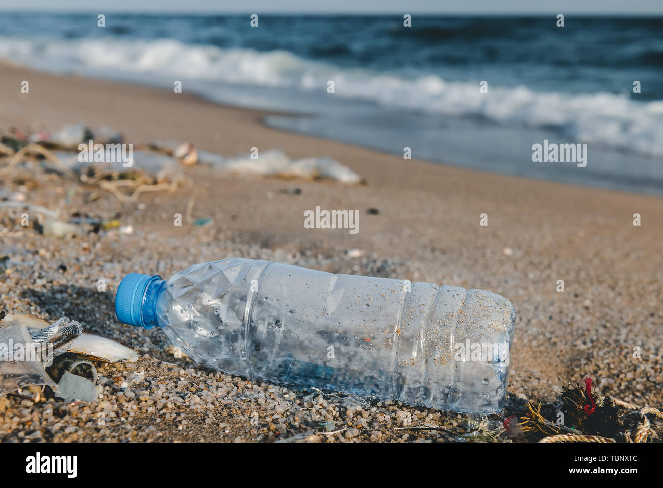 Plastic bottle garbage on the beach in pollution sea scape environment ...