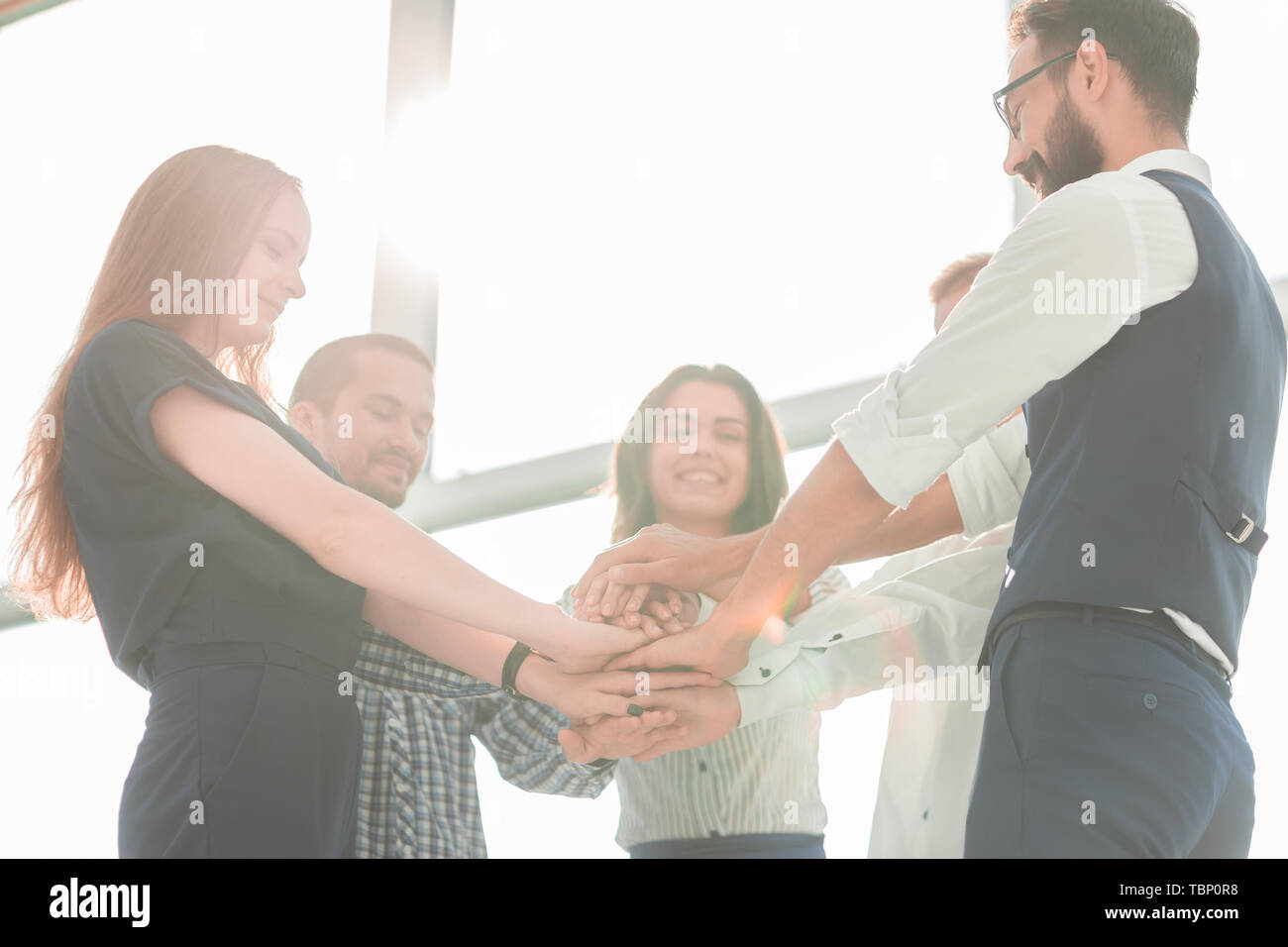 Close-Up of hands business team showing unity with putting their hands togethe. concept of ...