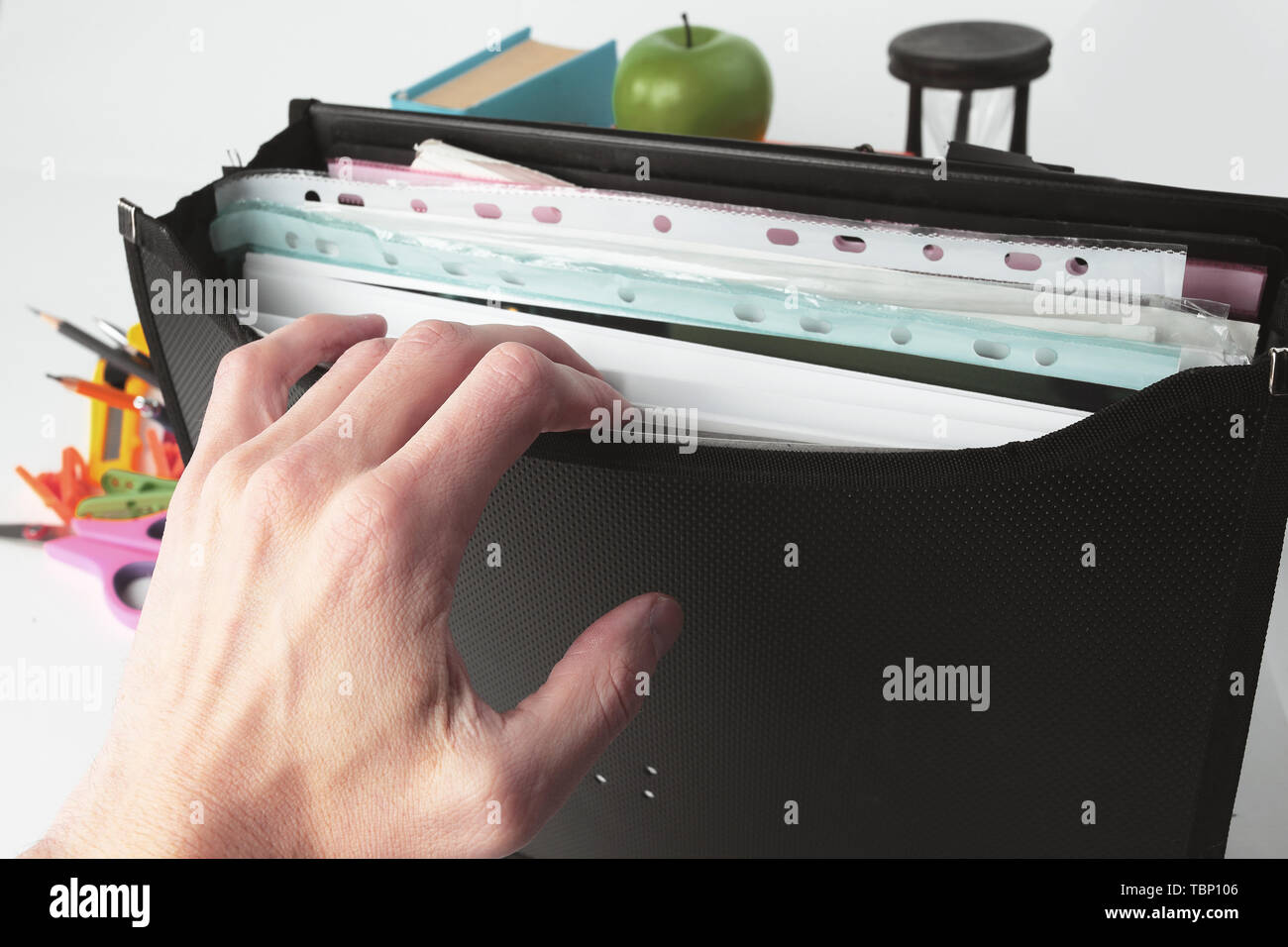 close up. briefcase with file folders and school supplies on white ...