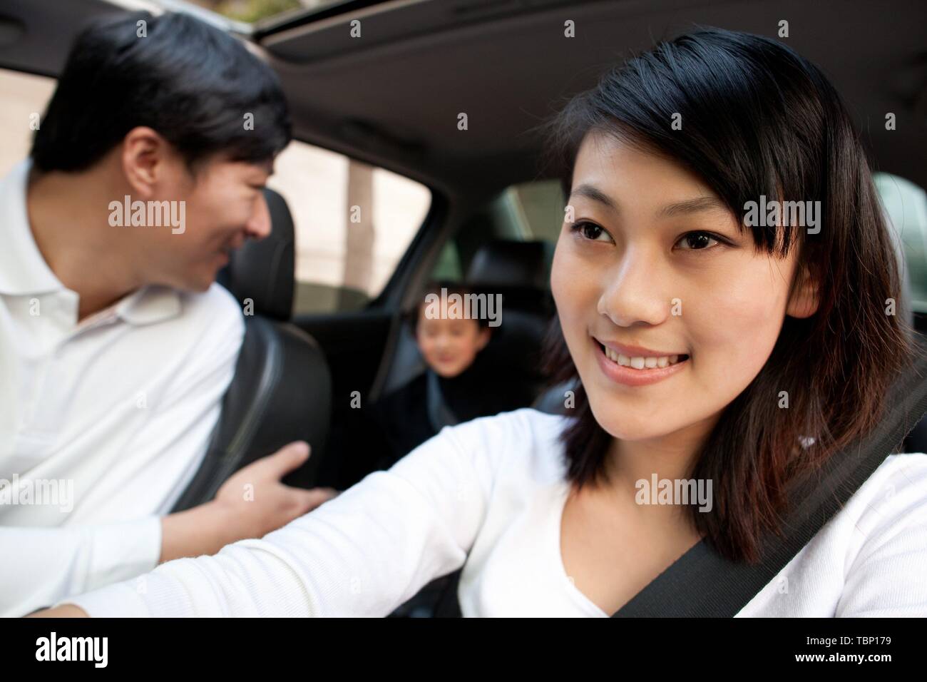Young asian man driving a car hi-res stock photography and images - Alamy