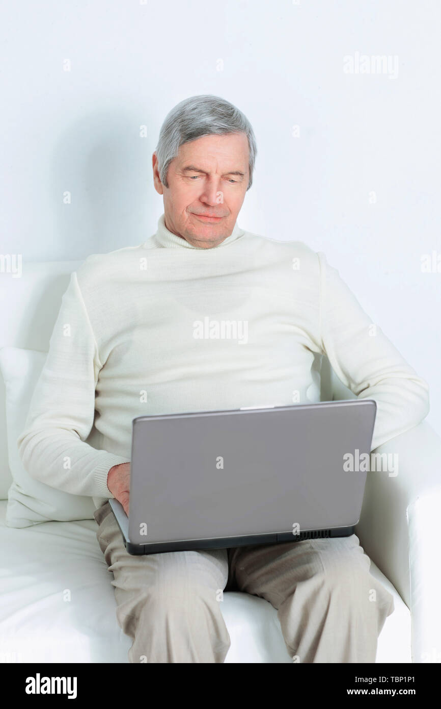 elderly man working on a laptop.isolated on white background Stock ...