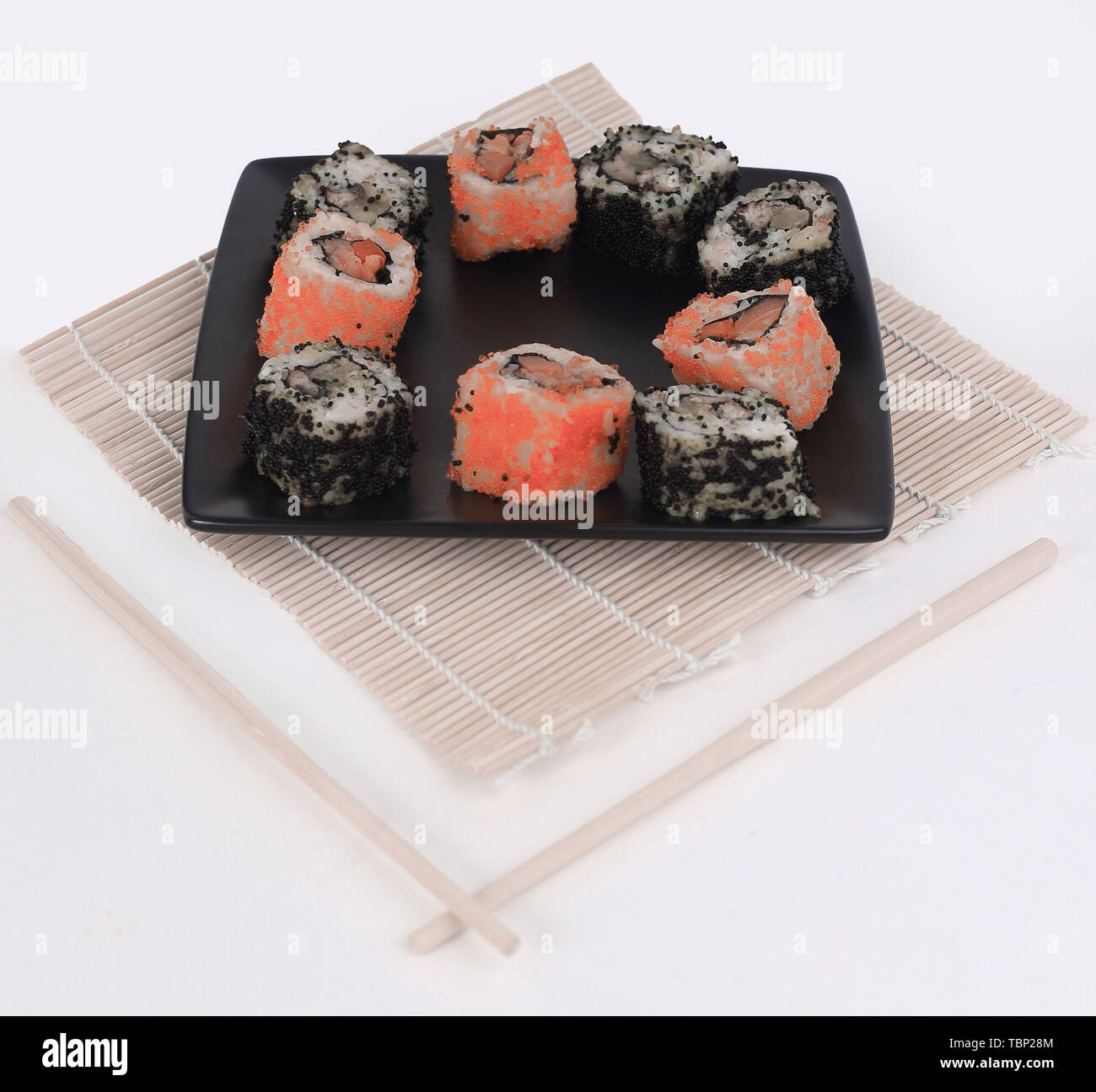 different types of Maki sushi on a black plate.isolated on white ...