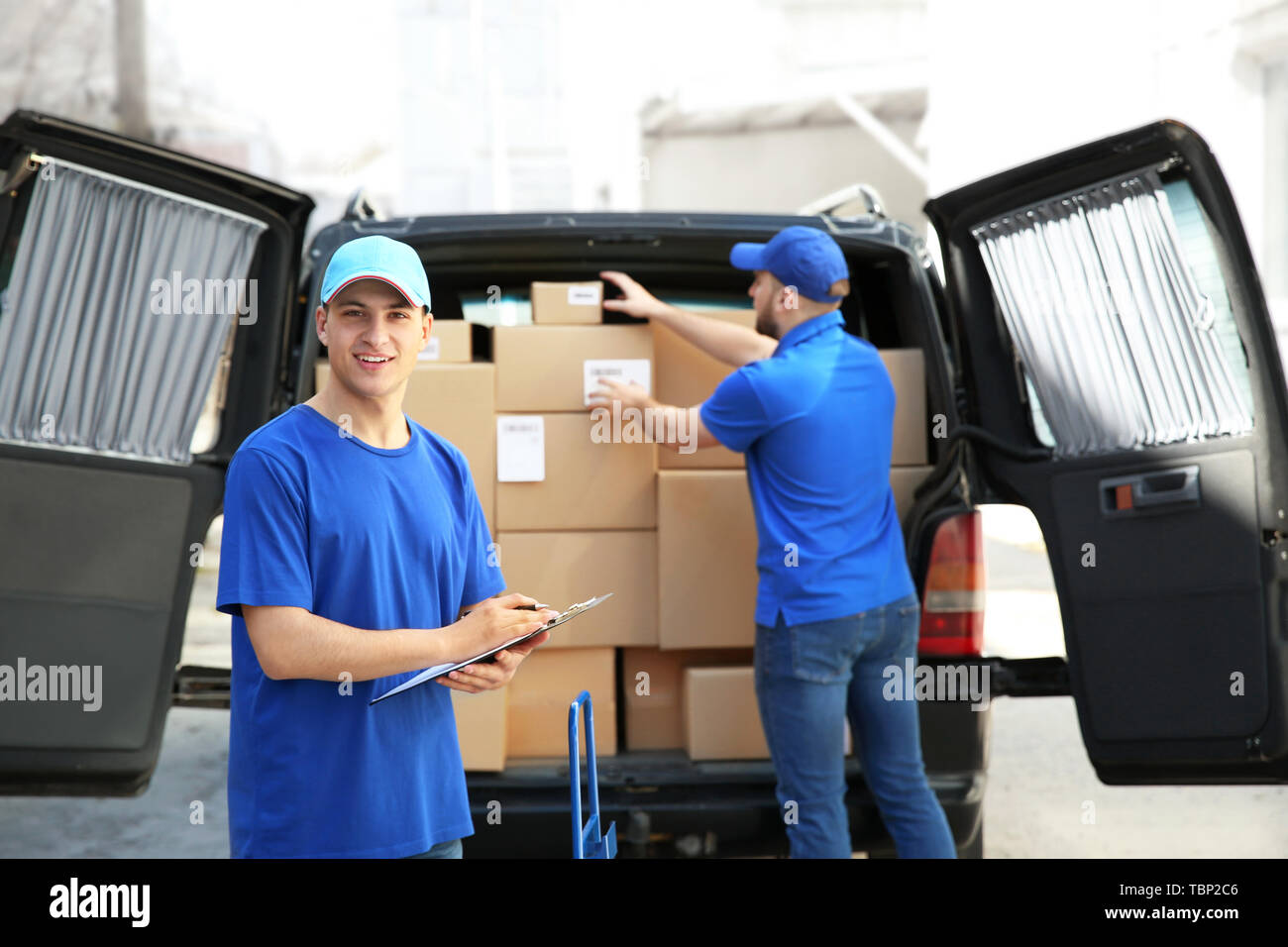 Man unloading parcels from the hi-res stock photography and images - Alamy